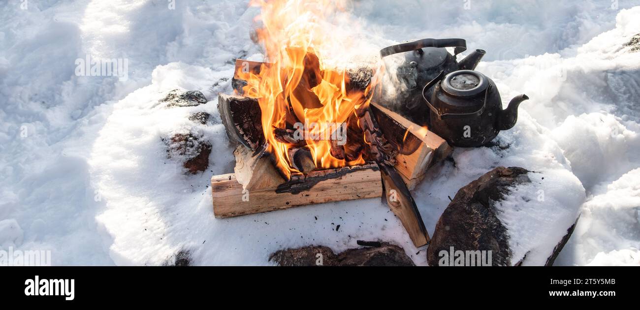 Winter campfire in the snow Stock Photo - Alamy
