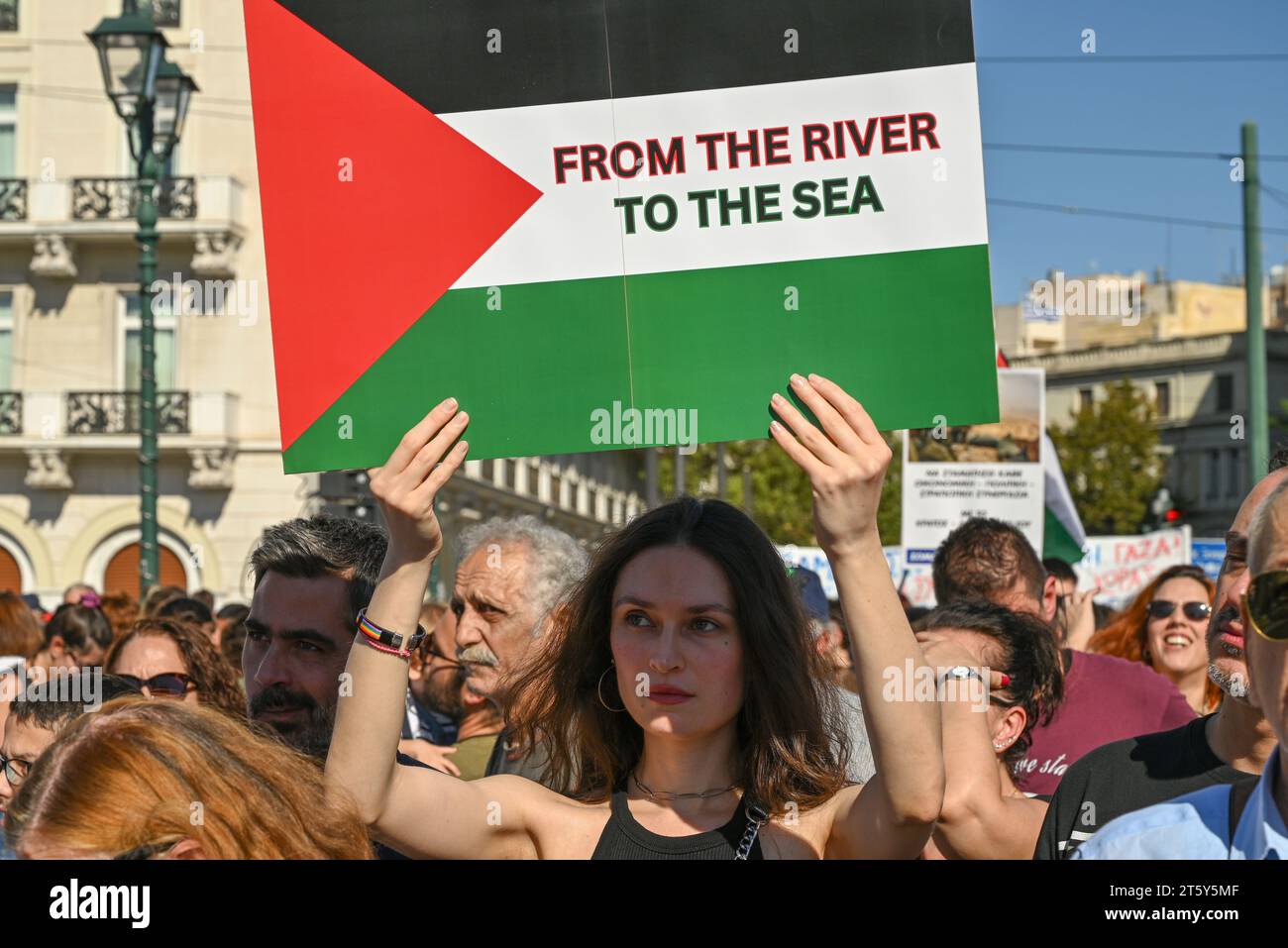 Athens, Greece. 5th Nov 2023. A woman holds a placard with the ...