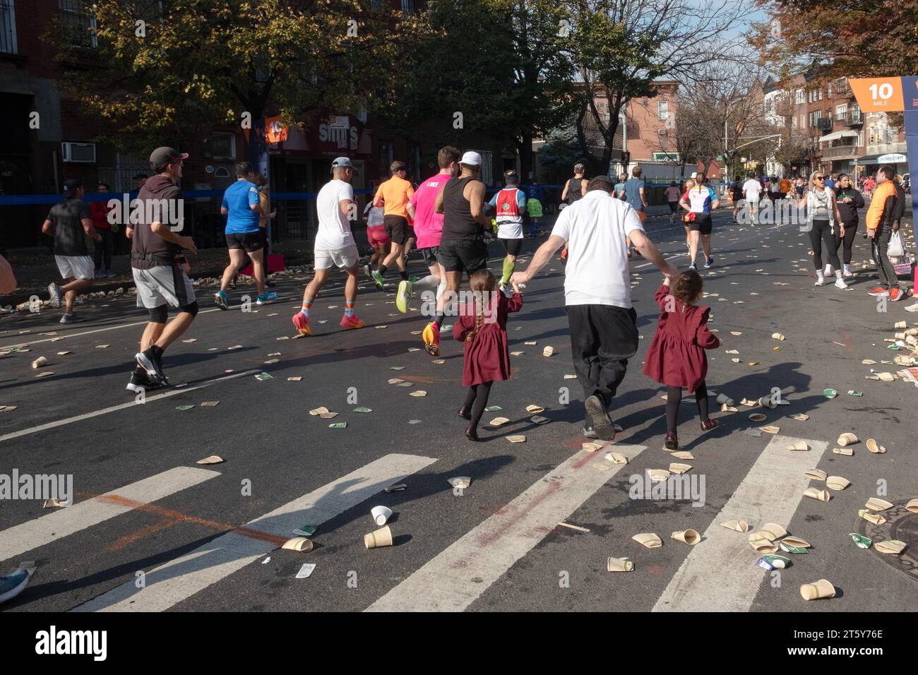 An orthodox Jewish father & his 2 identically dressed daughters join ...