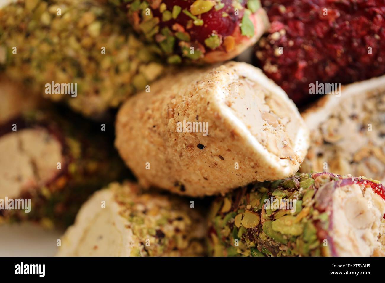 Rolls of turkish delight with many different flavors and fillings close ...