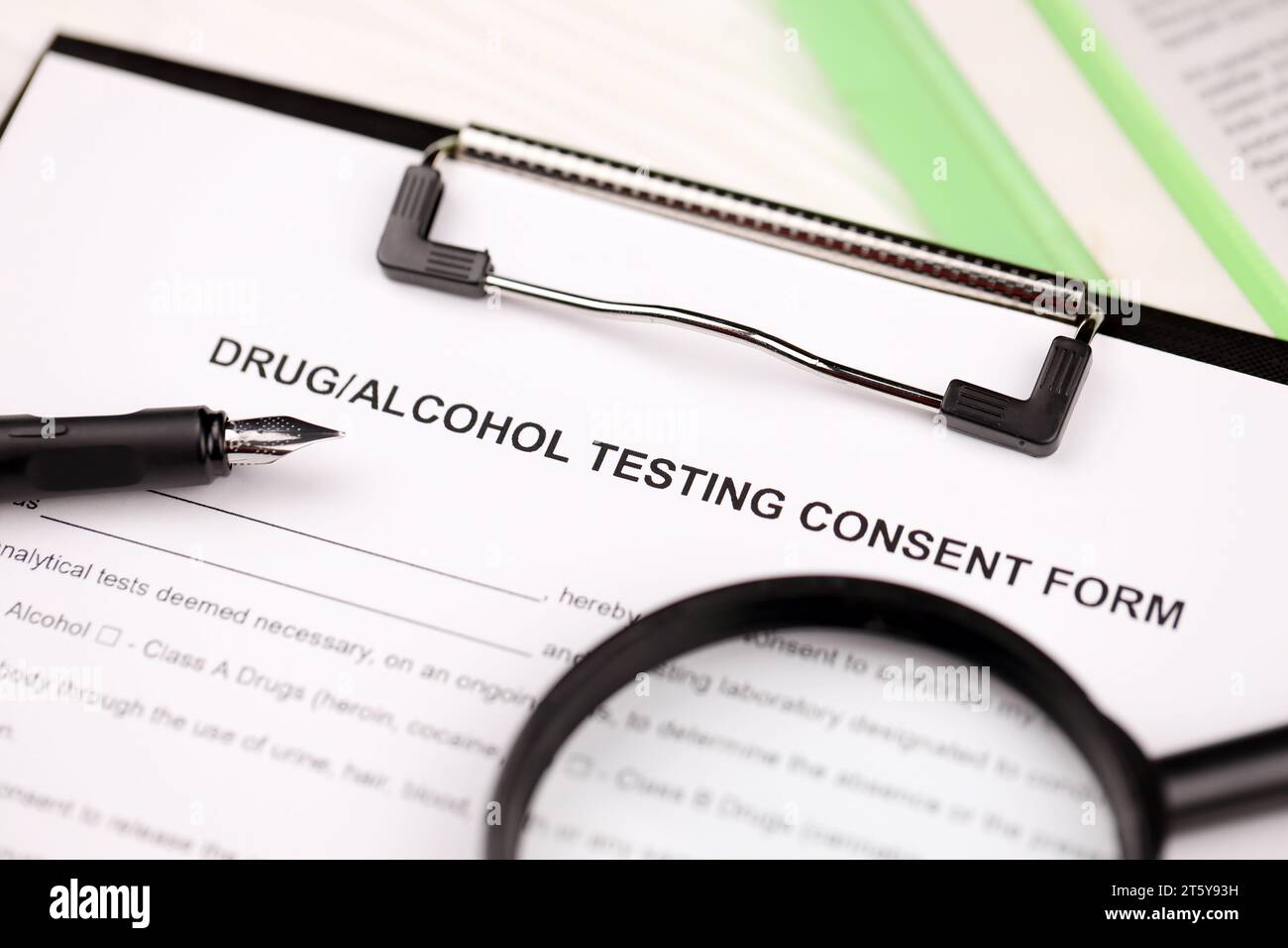 Drug and alcohol testing consent form on A4 tablet lies on office table ...