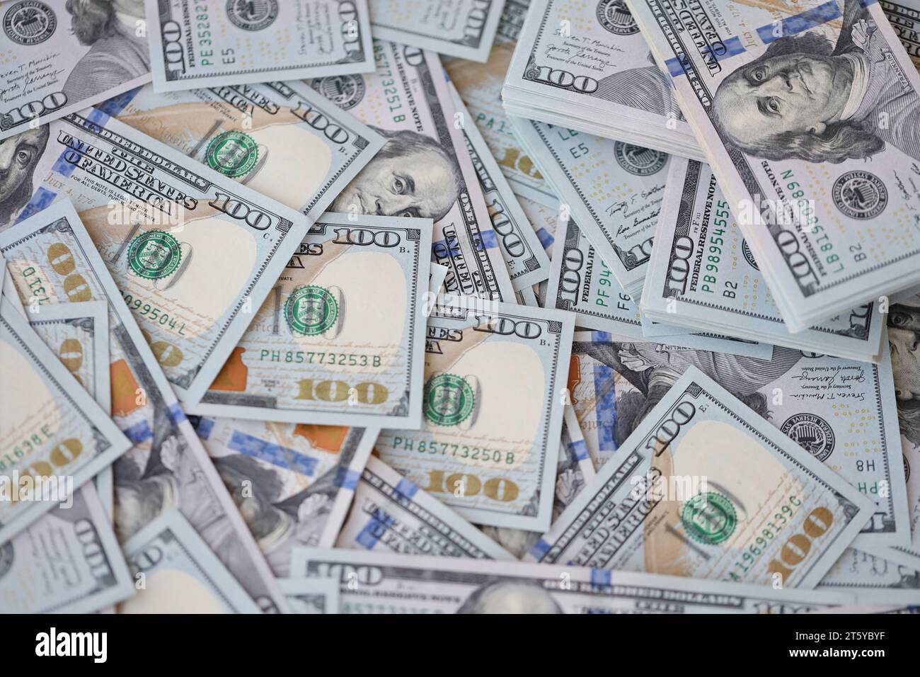 Very big amount of US hundred dollar bills close up. Huge quantity of ...