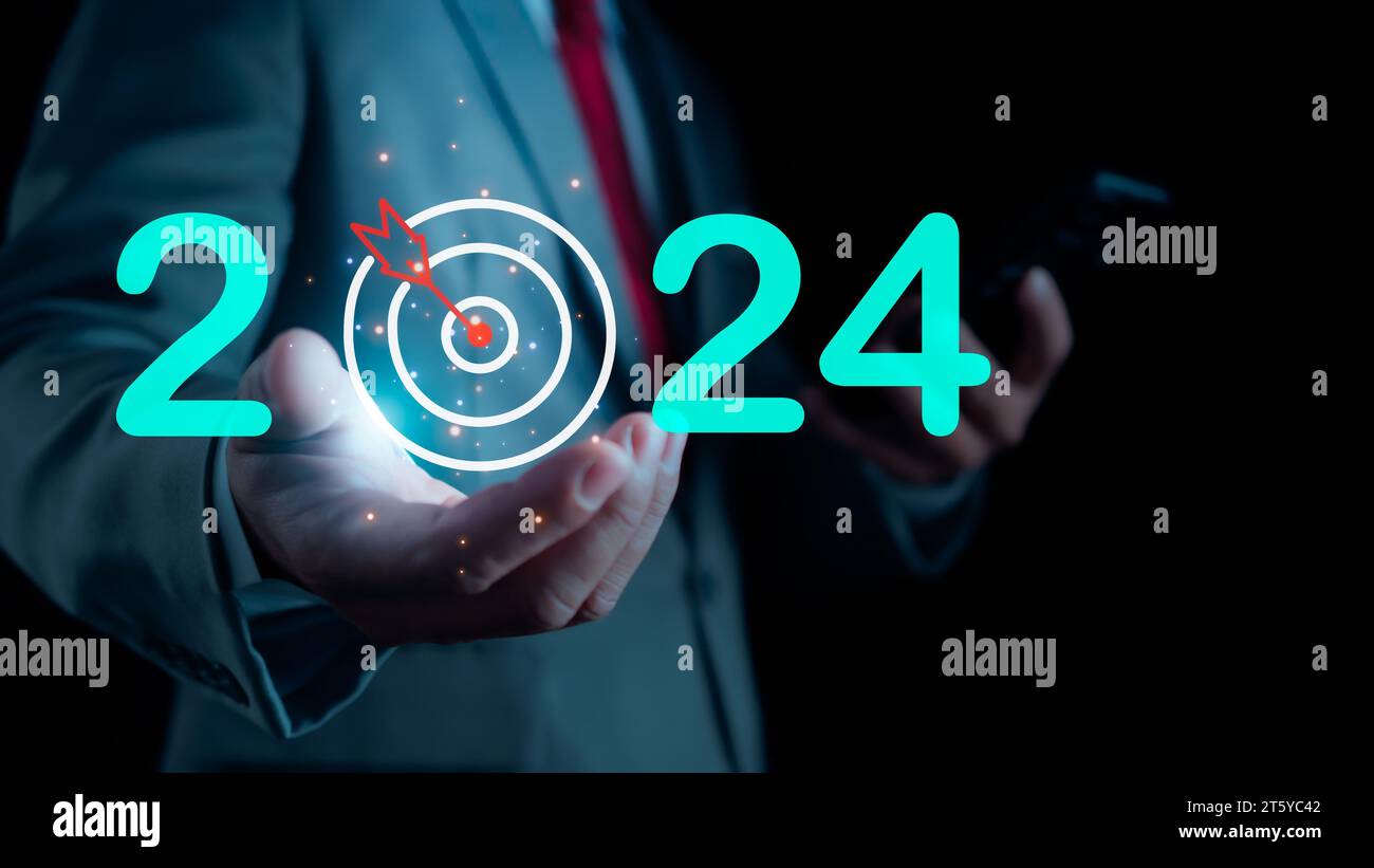 Businessman showing letters 2024 showing setting goals for 2024 ...