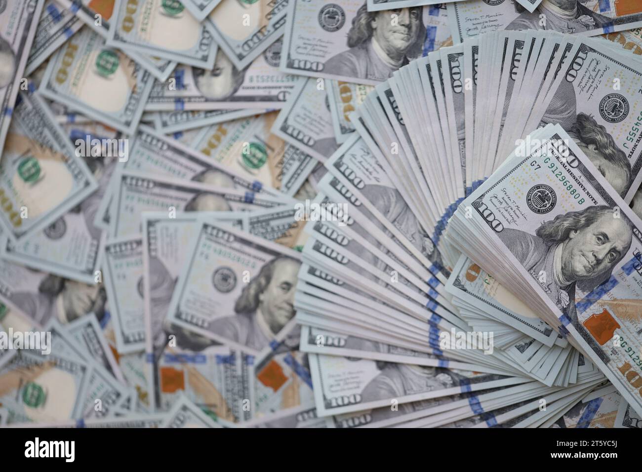 Very big amount of US hundred dollar bills close up. Huge quantity of ...