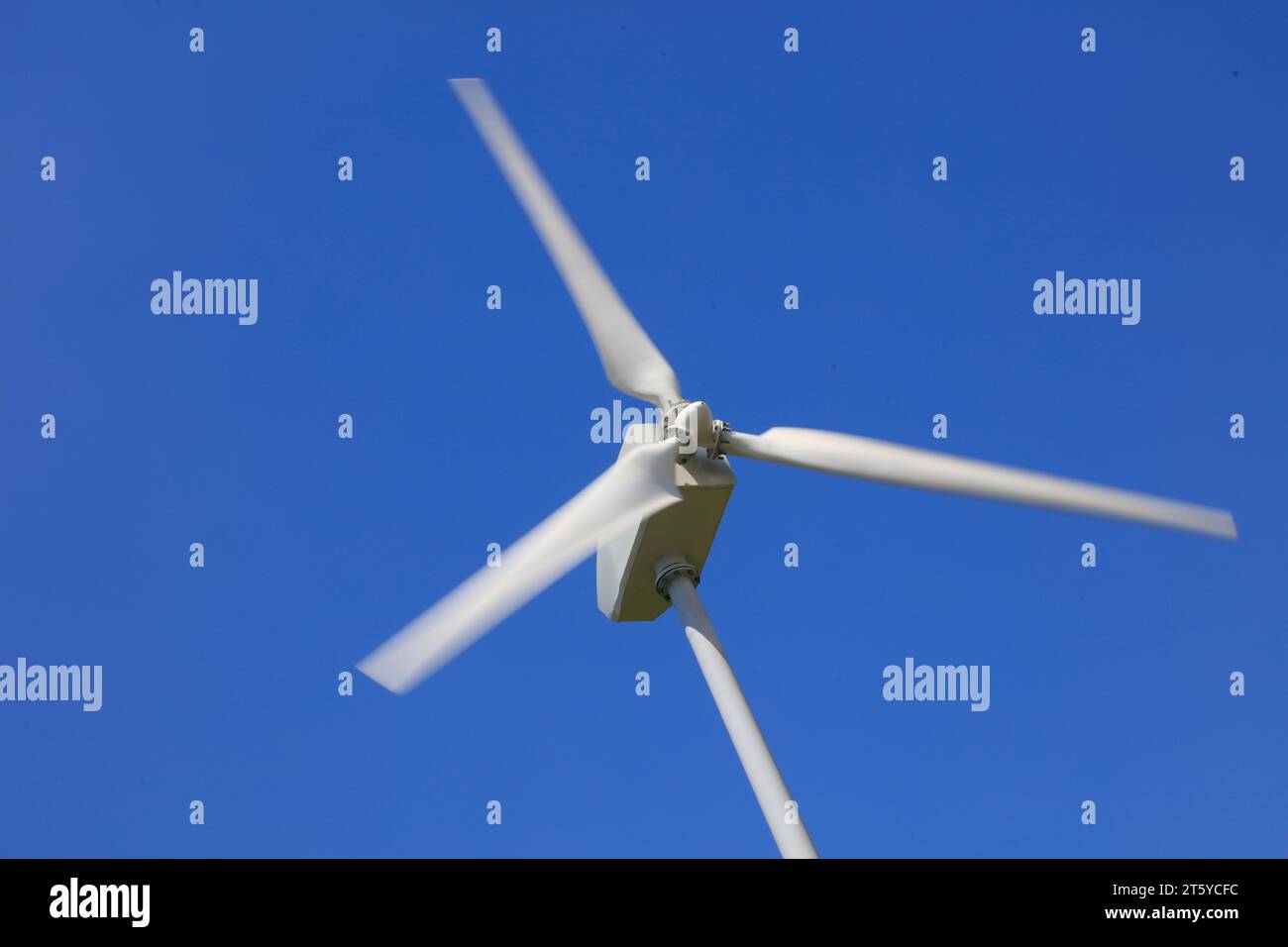 wind driven generator under blue sky Stock Photo - Alamy