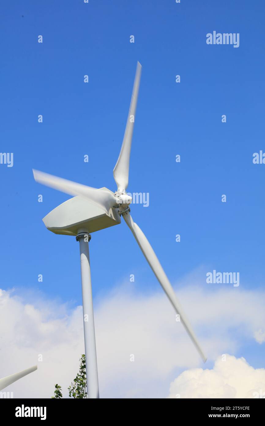 wind driven generator under blue sky Stock Photo - Alamy