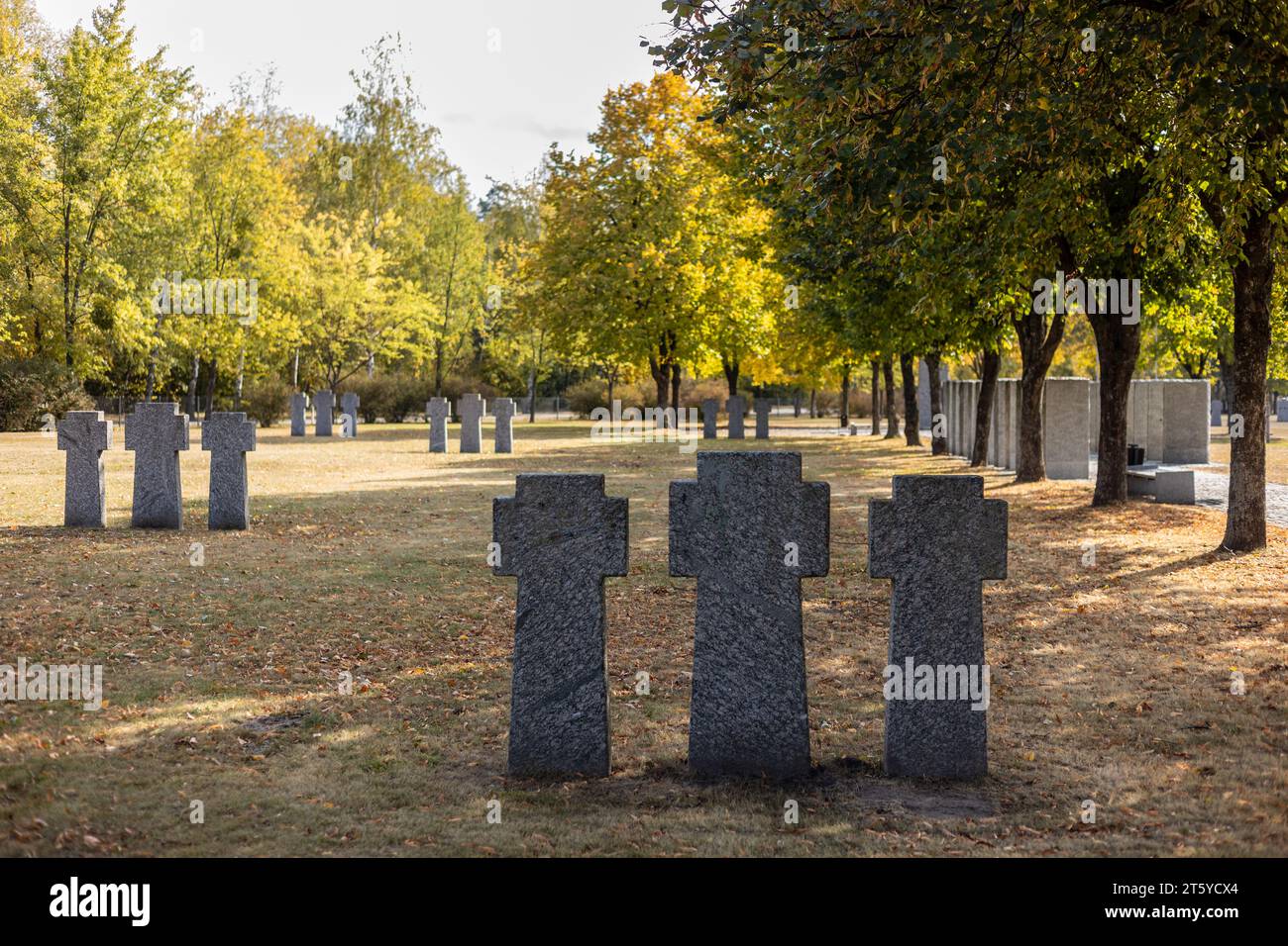Stone tombstones in the German cemetery in the fall. Beautiful German ...
