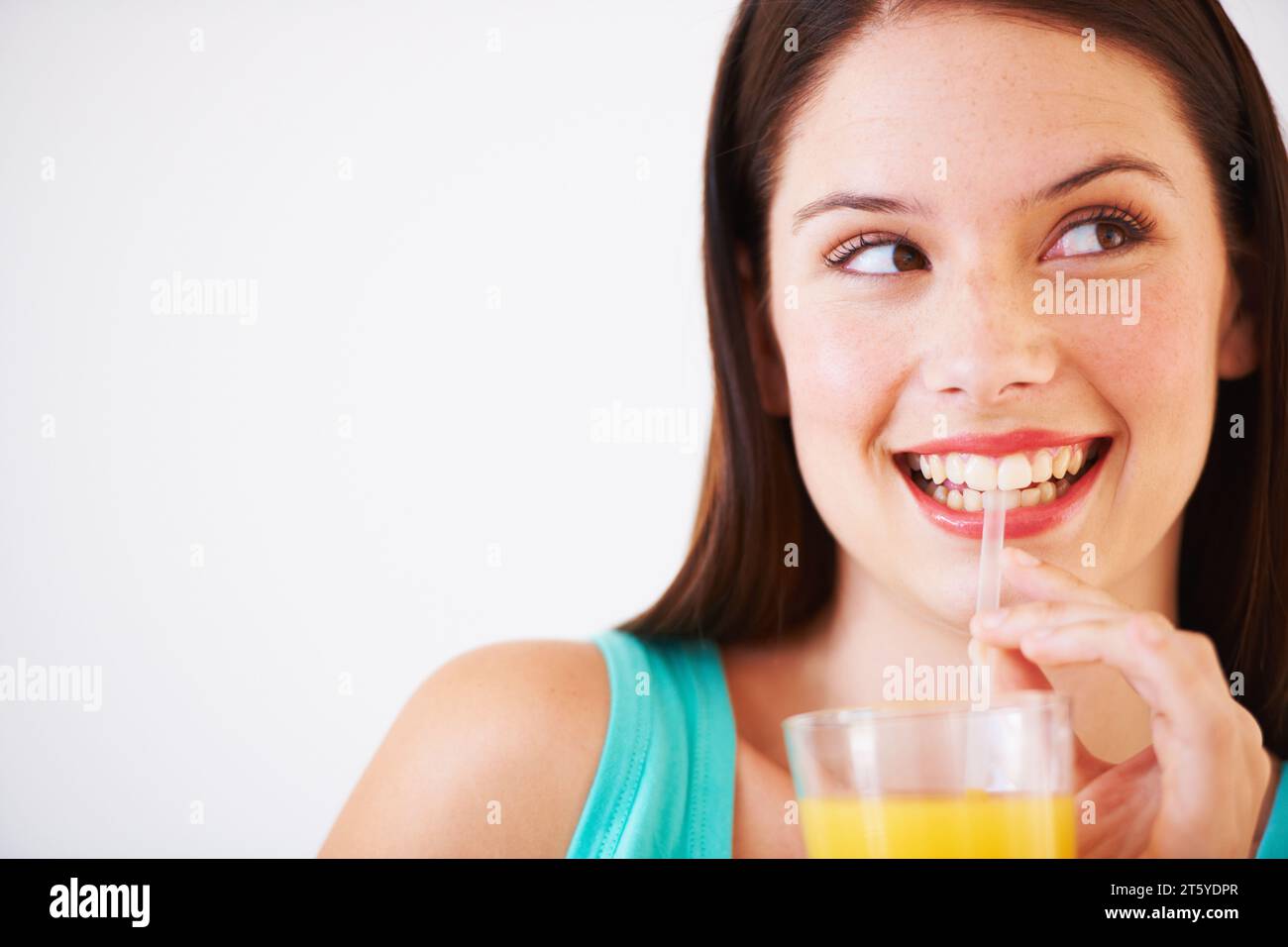 Happy, drinking and face of woman with juice for nutrition, wellness ...