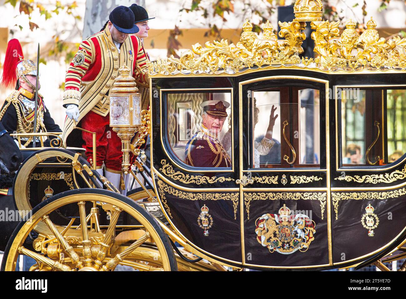 King Charles and Queen Camilla travel in a horse drawn carriage towards ...