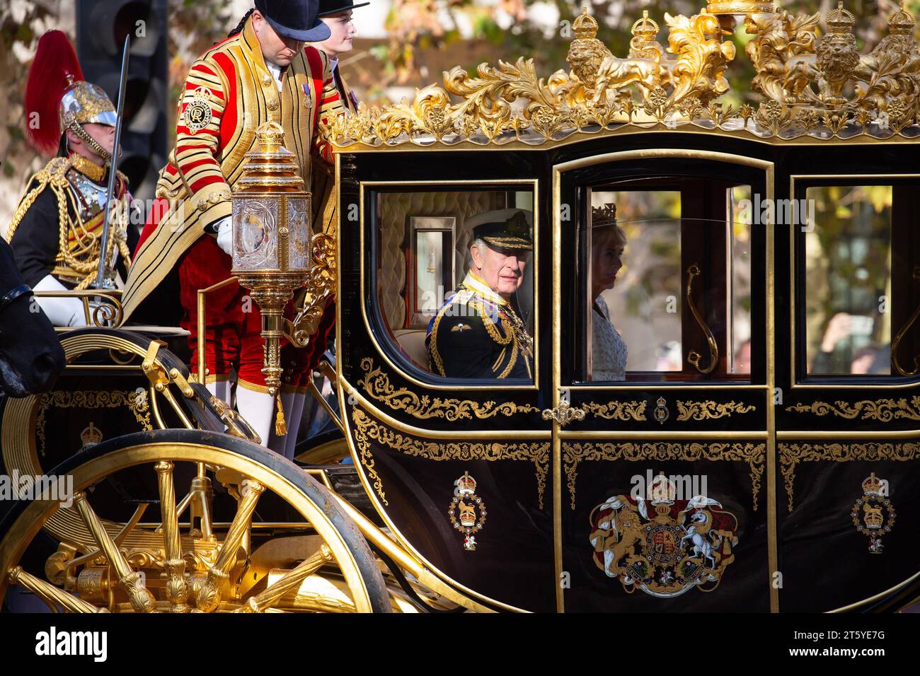 King Charles and Queen Camilla travel in a horse drawn carriage towards ...