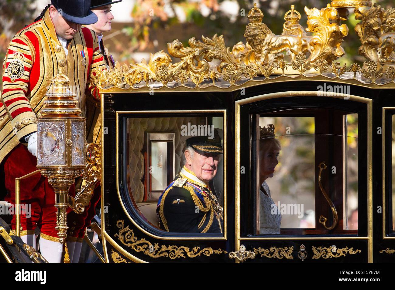 King Charles and Queen Camilla travel in a horse drawn carriage towards ...