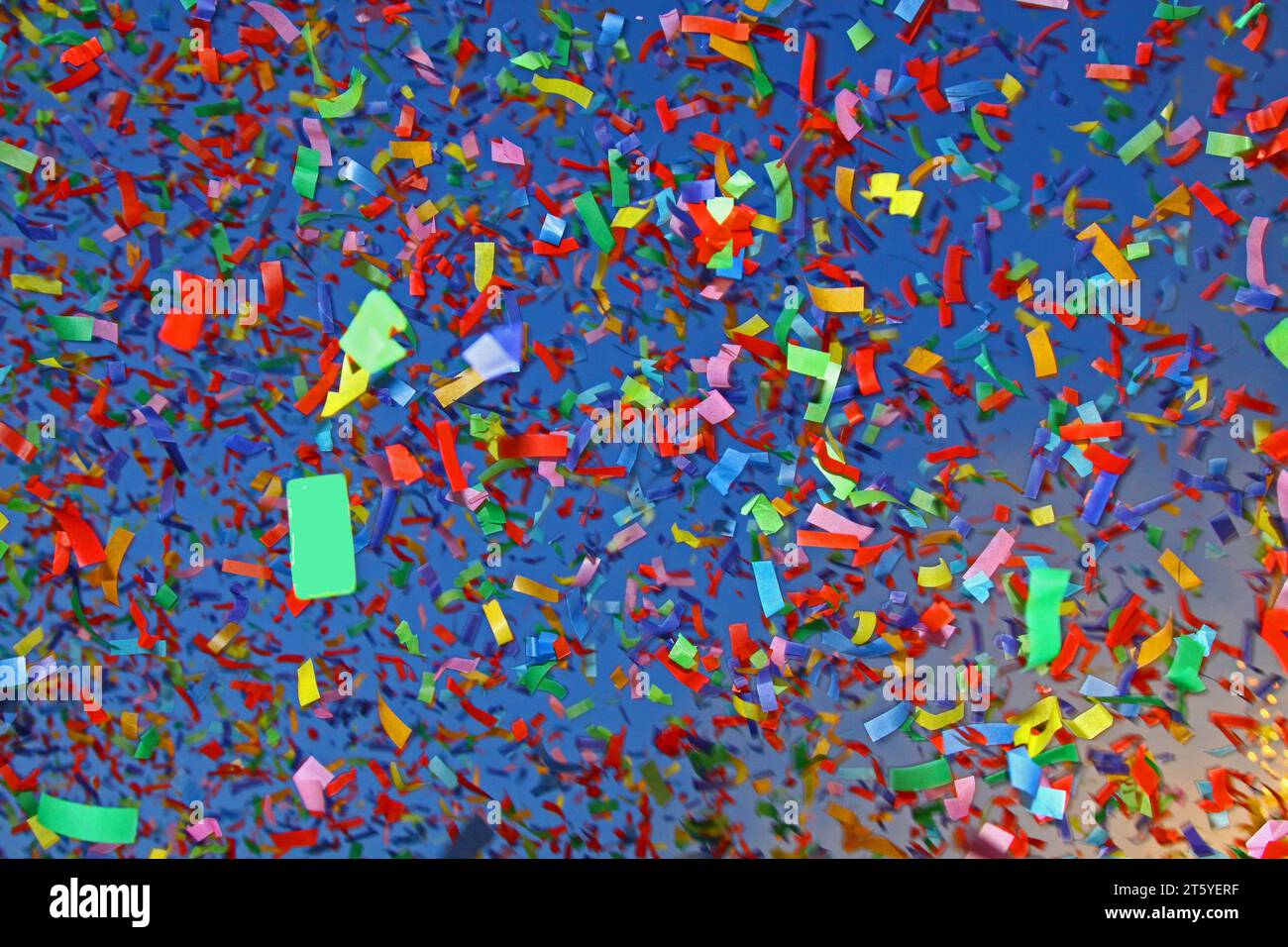 Multi color confetti, close up, blizzard of paper. Background of randon ...