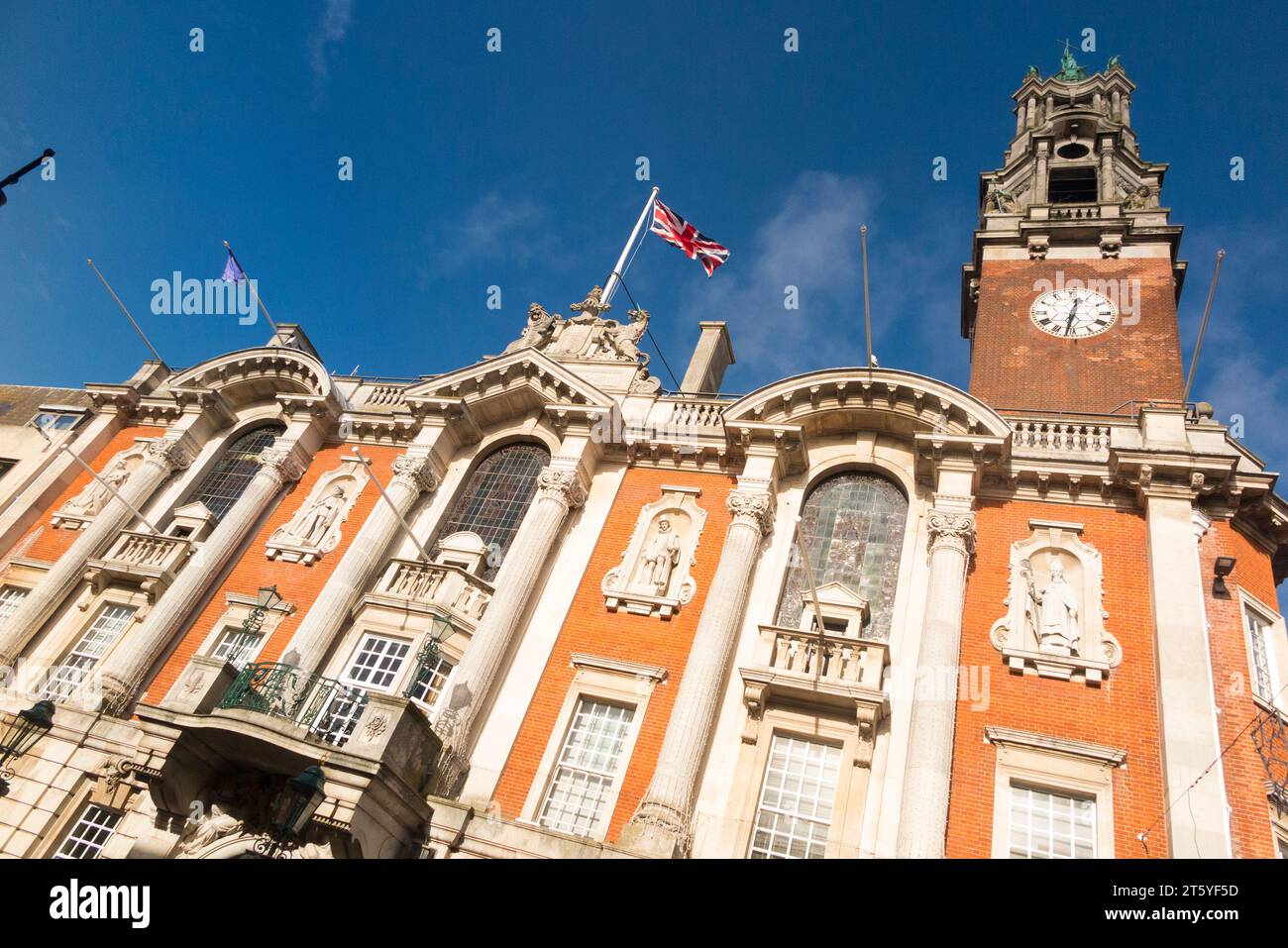 Union Jack flag flying on a sunny day with blue sky above Colchester ...