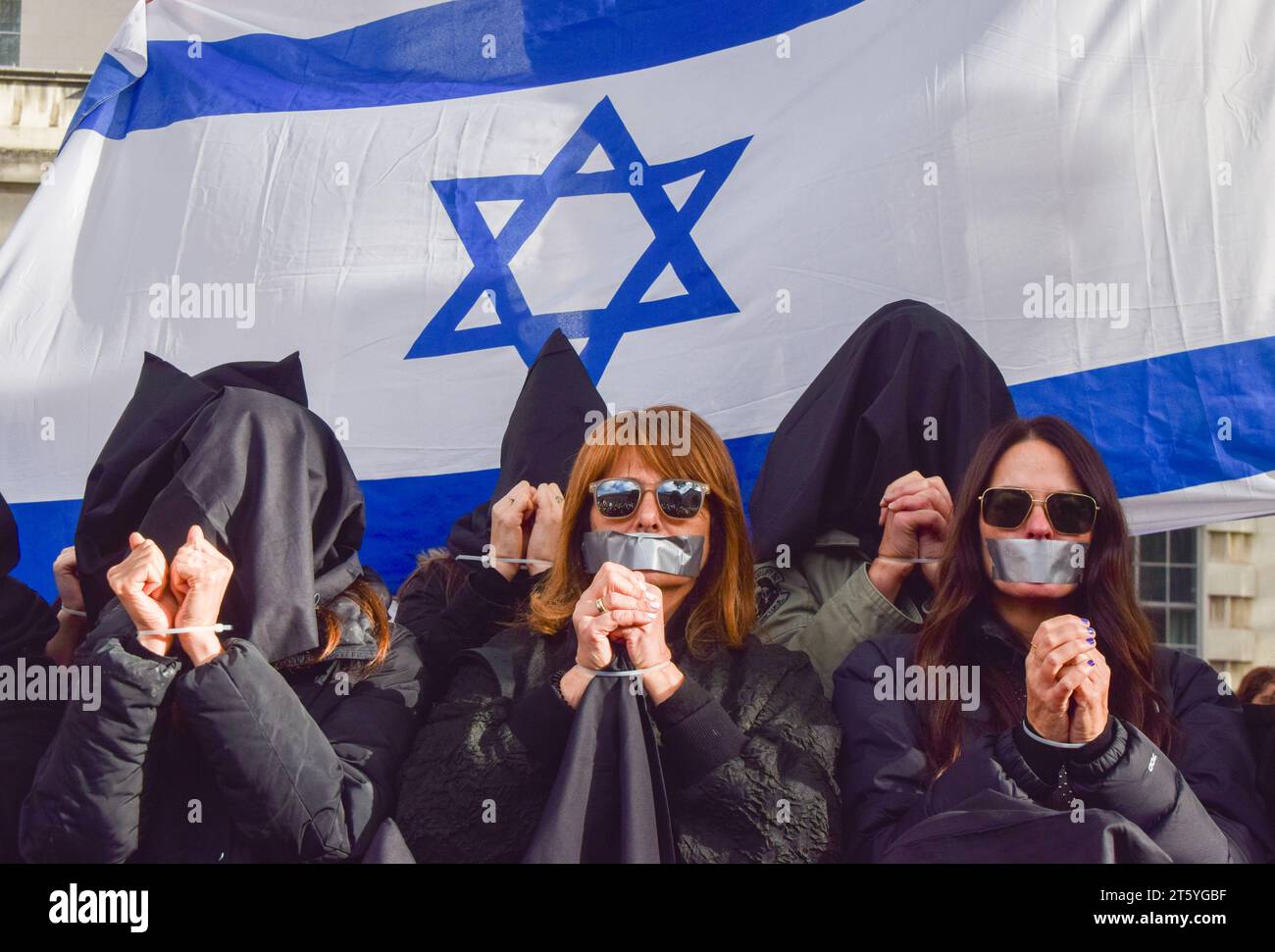 London, England, UK. 7th Nov, 2023. Protesters have their hands tied ...