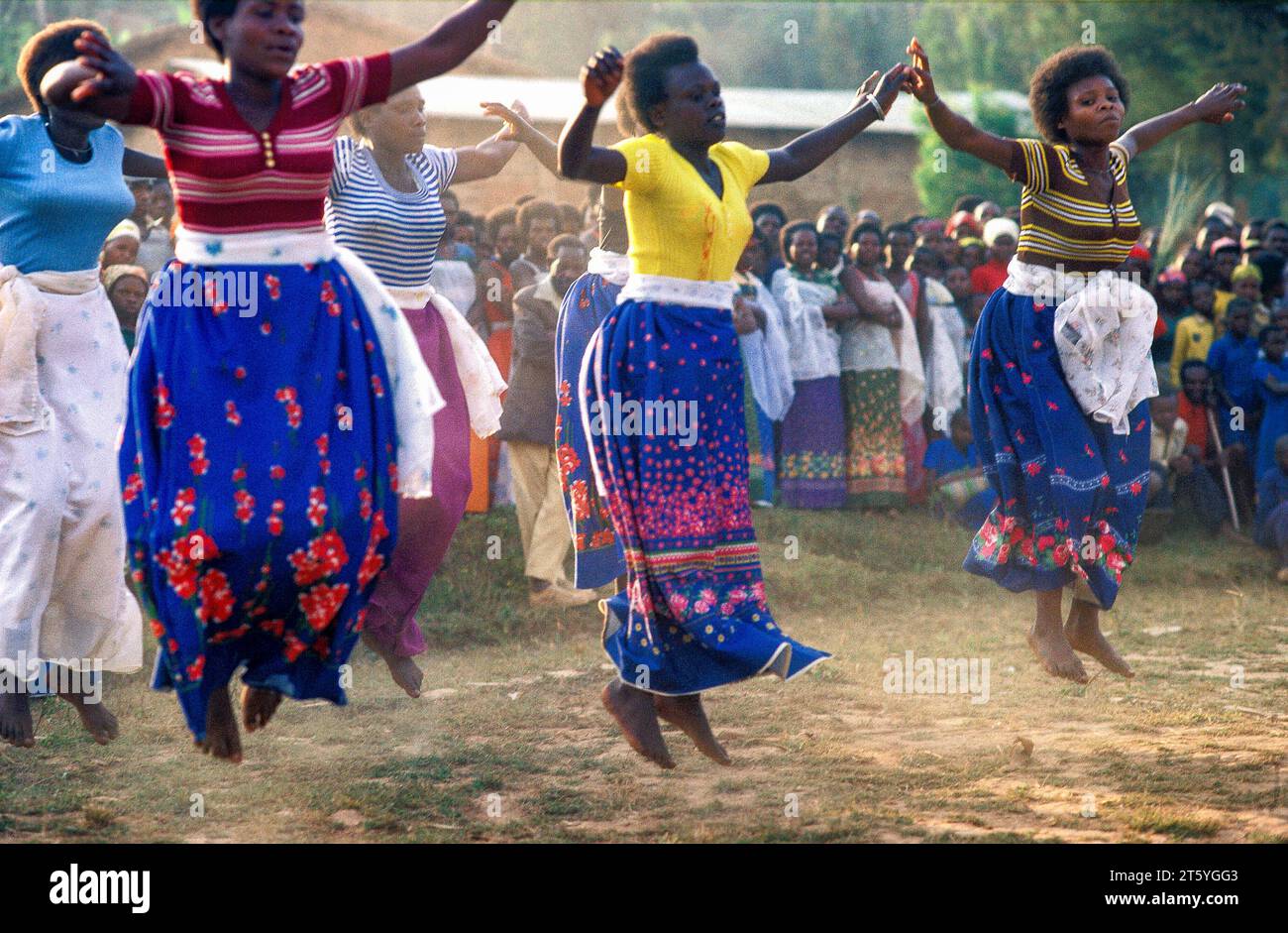 Rwanda, Mbanza; Men and women performing a traditional dance during a ...