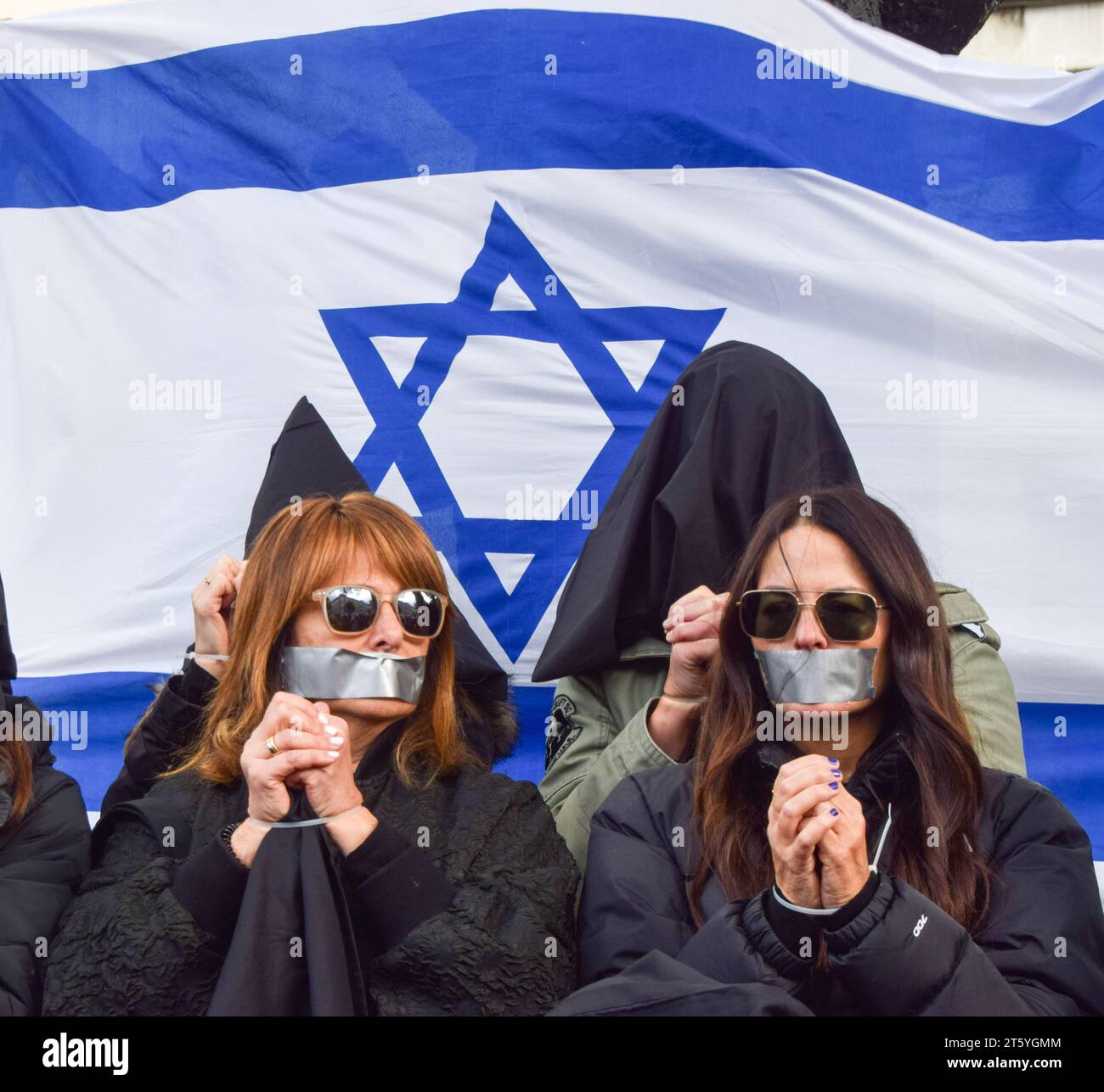 London, England, UK. 7th Nov, 2023. Protesters have their hands tied ...