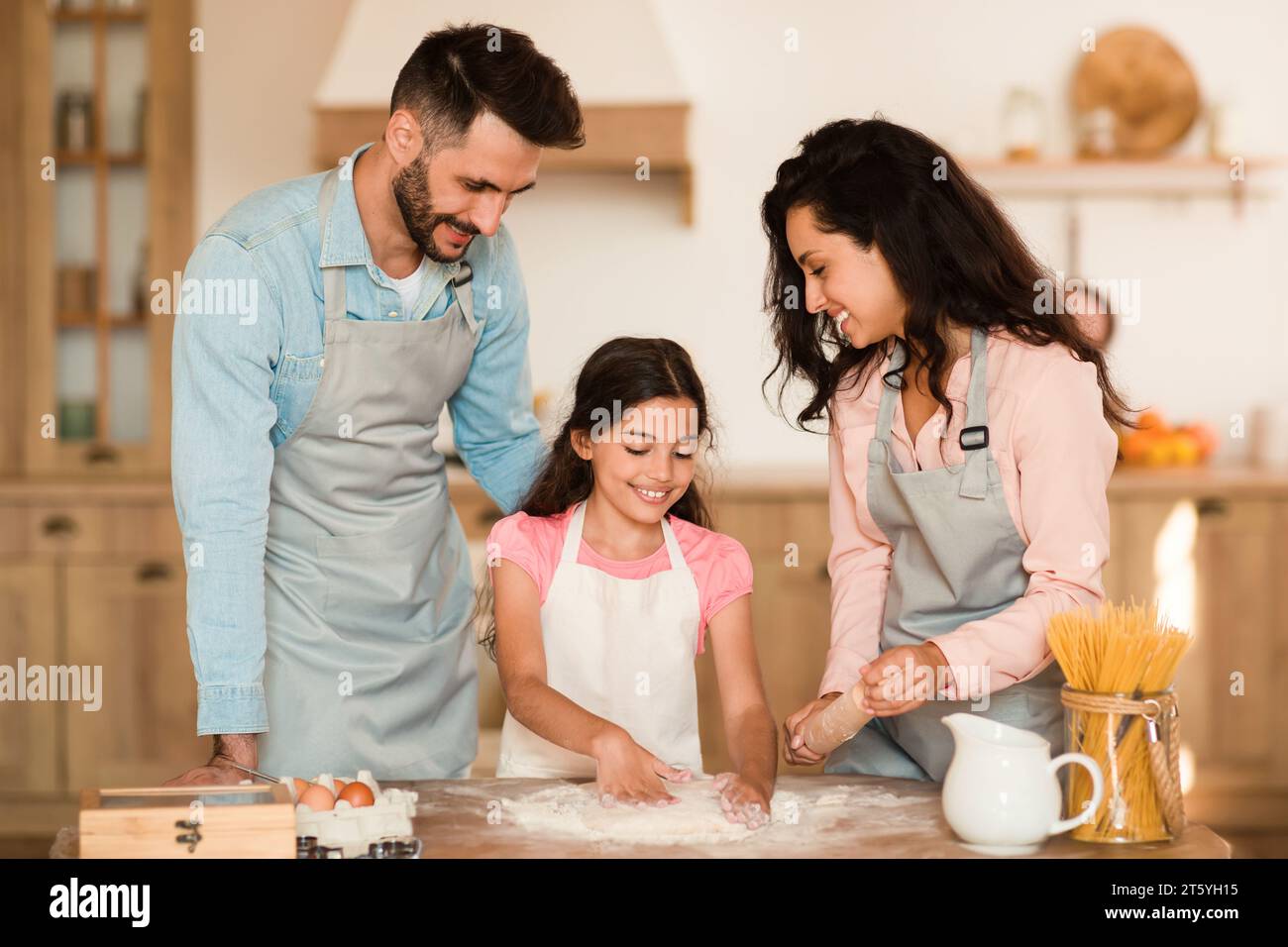 Family cooking together in kitchen Stock Photo - Alamy