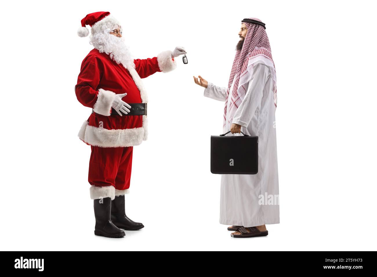 Full length profile shot of santa claus giving car key to a saudi arab ...