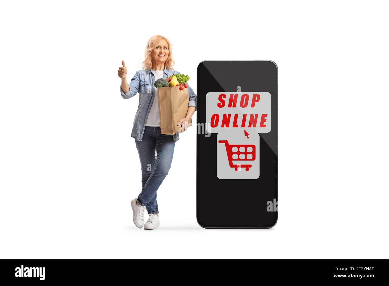 Woman with a grocery bag leaning on a big mobile phone with online ...