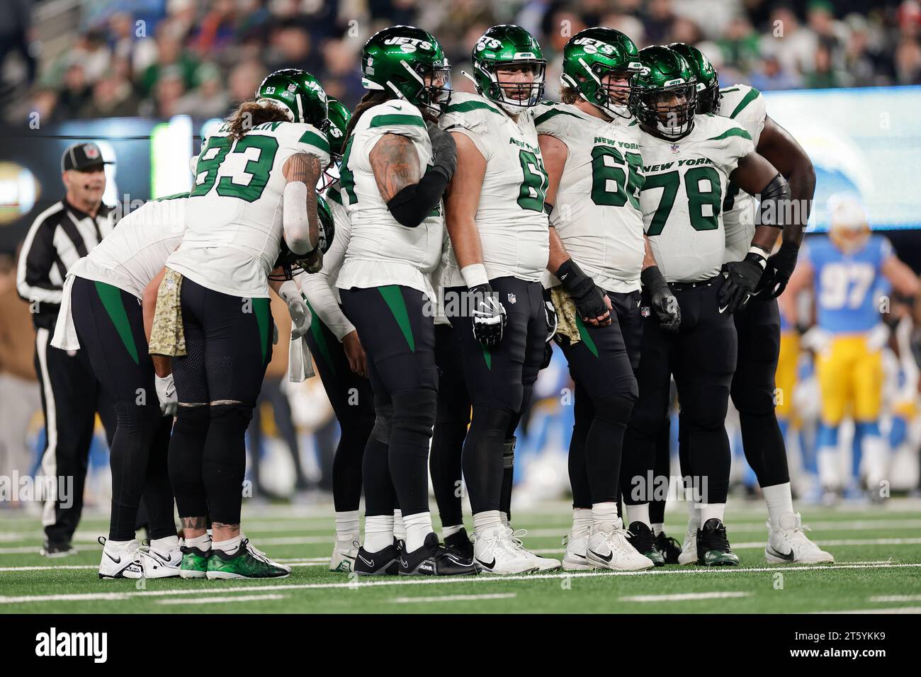 The New York Jets offensive line gathers at the line of scrimmage ...