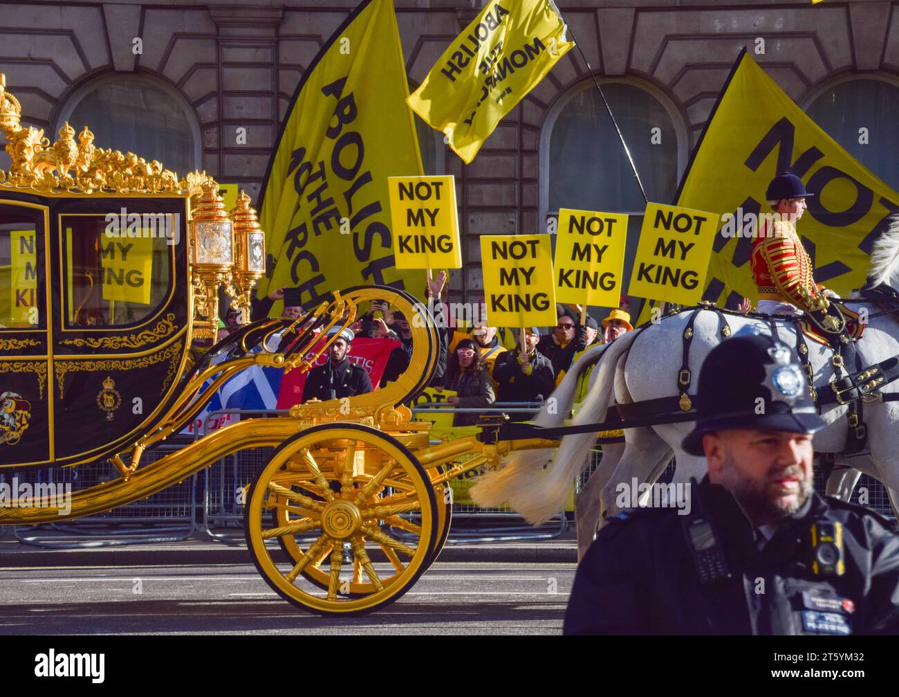 London, UK. 7th November 2023. Protesters hold up Not My King placards ...
