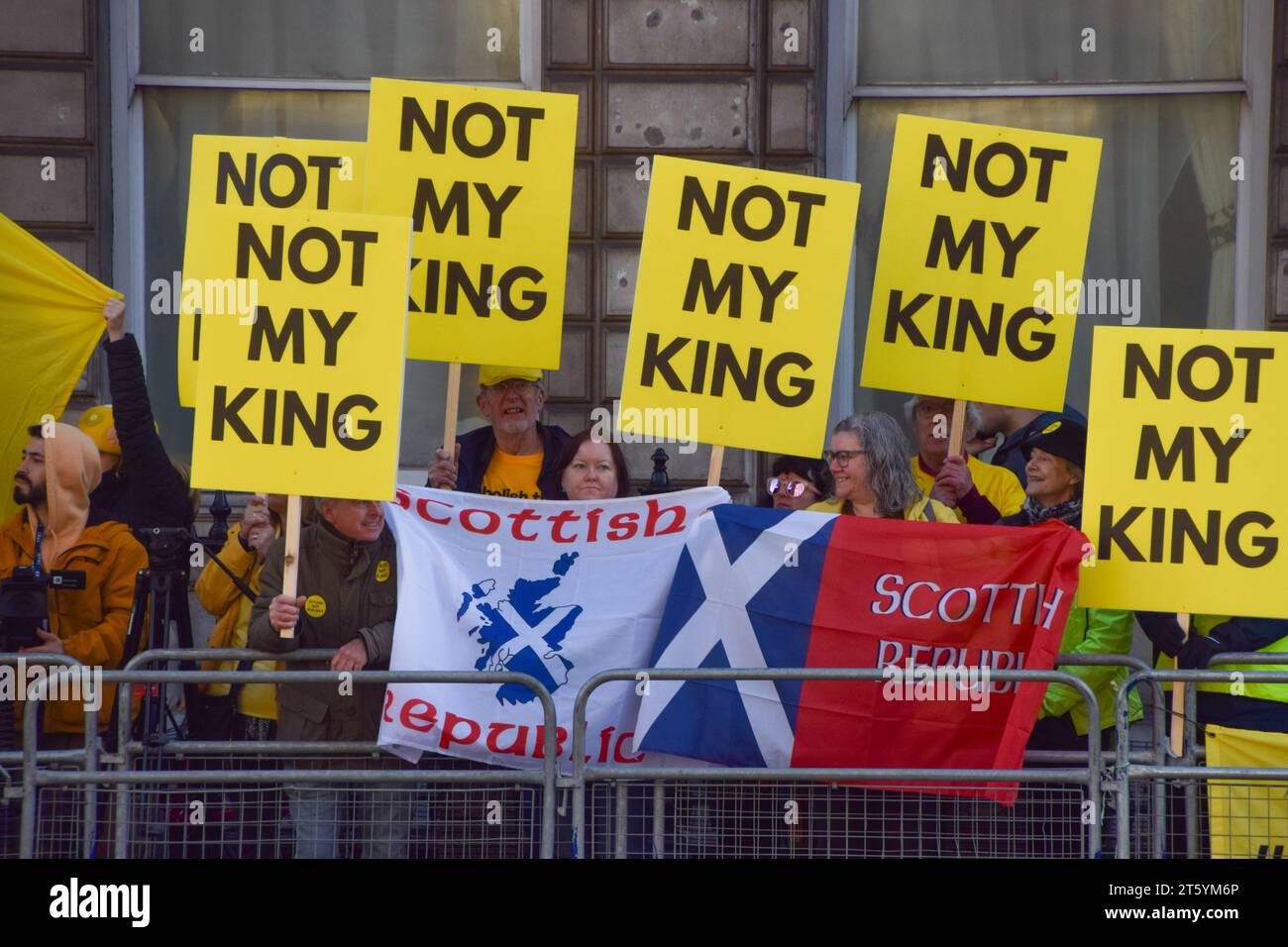 London, UK. 7th November 2023. Protesters hold up Not My King placards ...