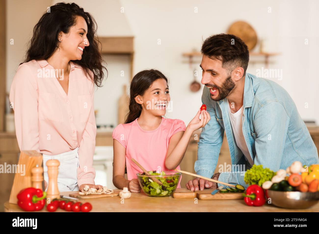 Family enjoys cooking time hi-res stock photography and images - Alamy