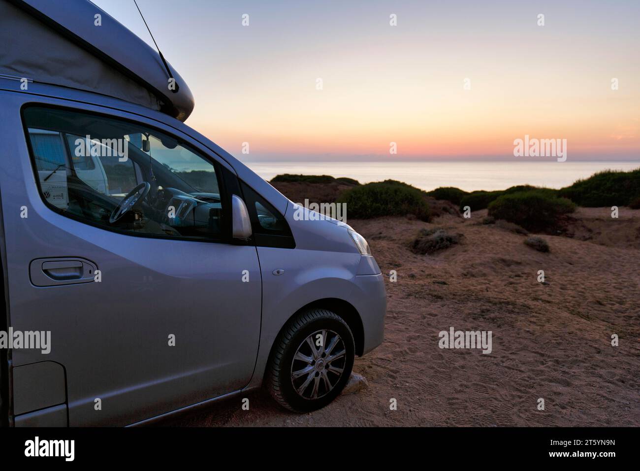 Campervan after sunset, motorhome on car park by the sea, mini camper ...