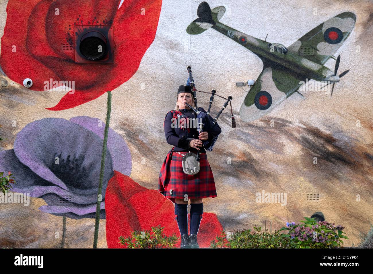 Scotland's national piper Louise Marshall plays alongside the Poppy ...