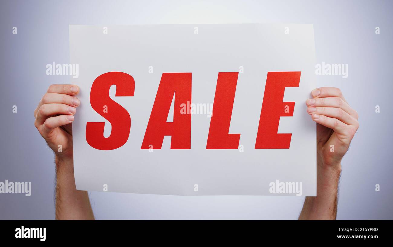 Sale, sign and hands with a poster, promotion and announcement of ...