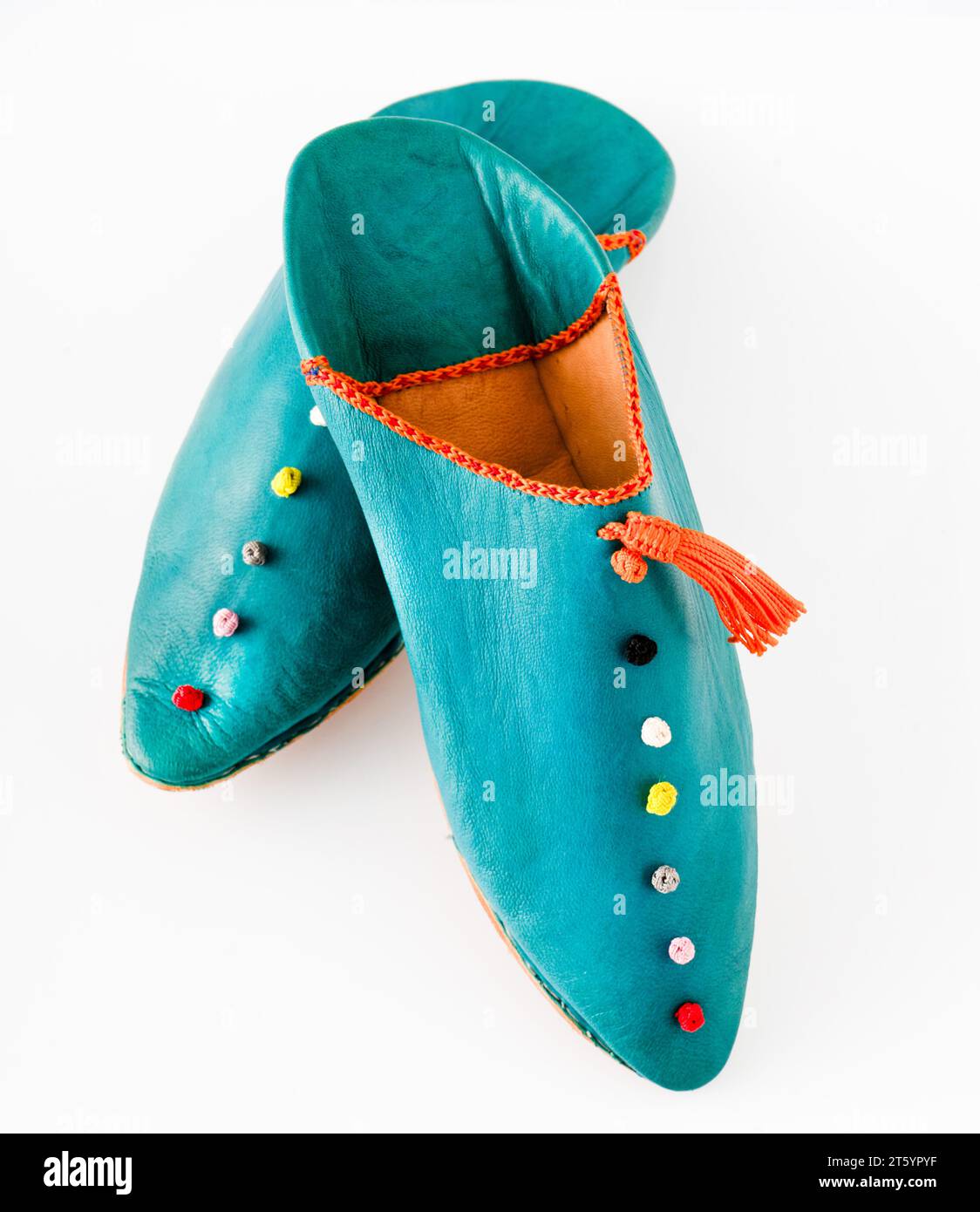 Homemade leather slippers isolated on white background. Pair of blue ...