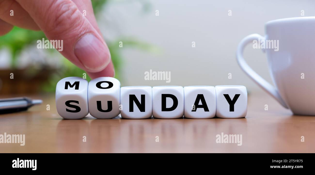 Symbol for a fresh start into the new week. Hand turns dice and changes ...