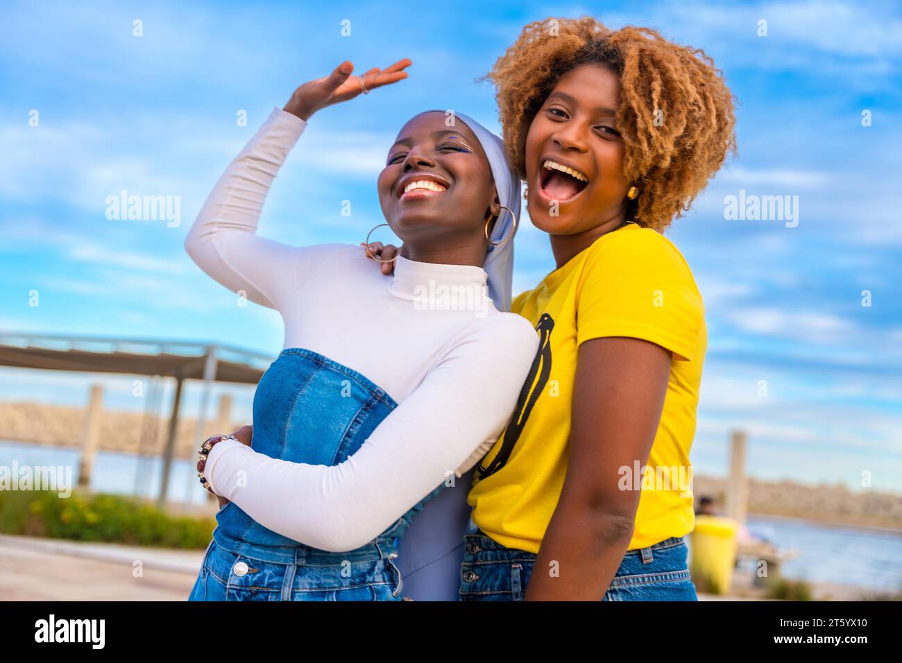 Happy african woman waving hand hi-res stock photography and images - Alamy