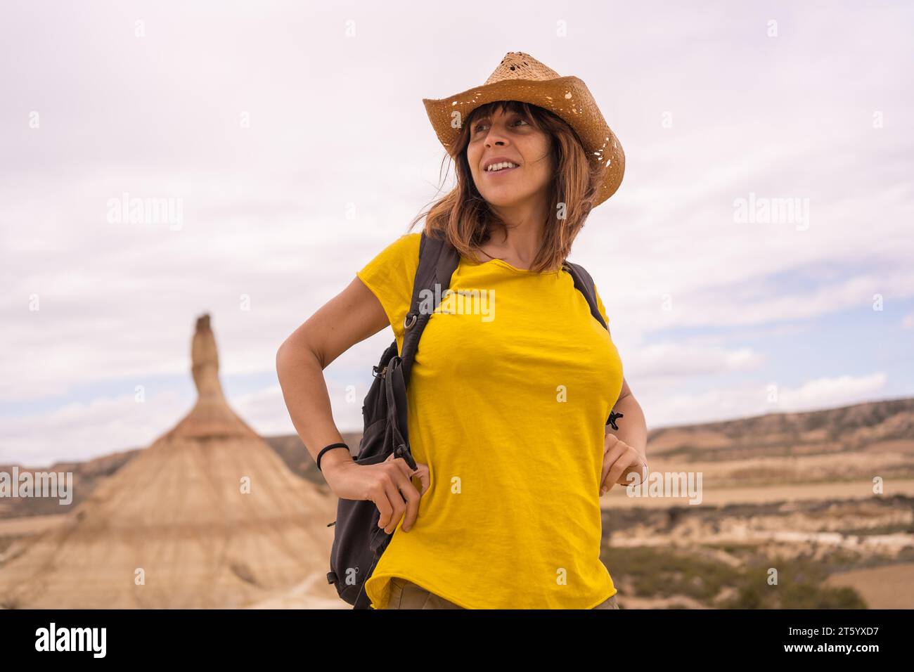 Low angle view portrait of a young woman trekking in the desert Stock ...