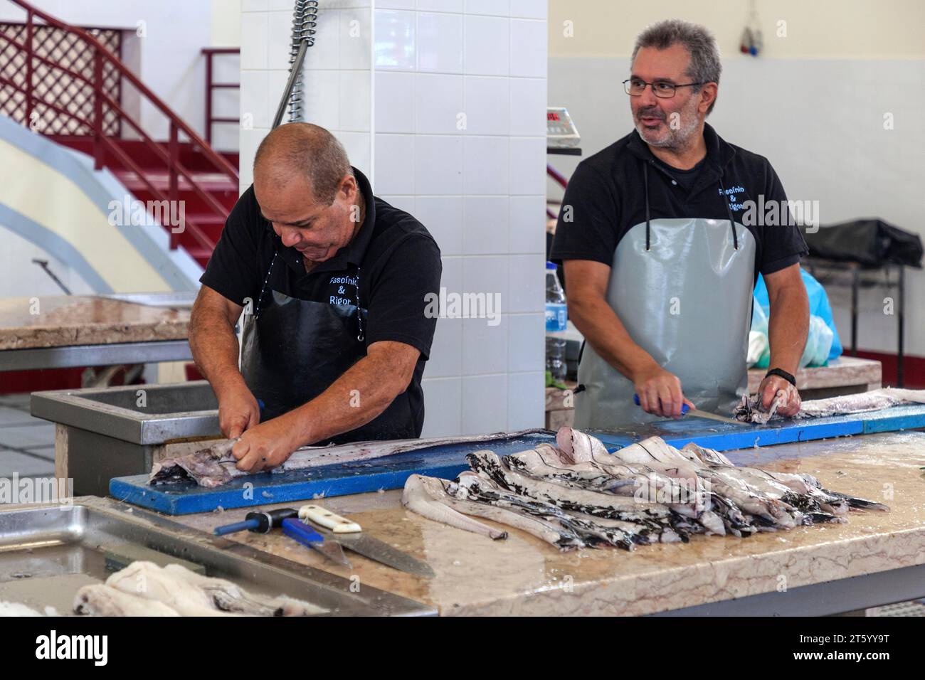 Black scabbardfish (Aphanopus carbo) being filleted, fish hall, fish ...