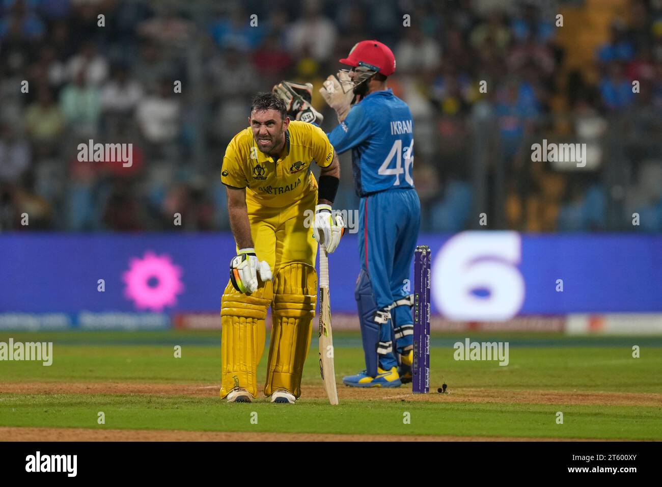 Australia's Glenn Maxwell, left, reacts in pain due to cramps during ...