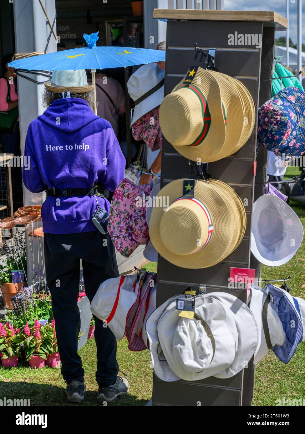 1 one person volunteering stands outside RHS Shop (information hub ...