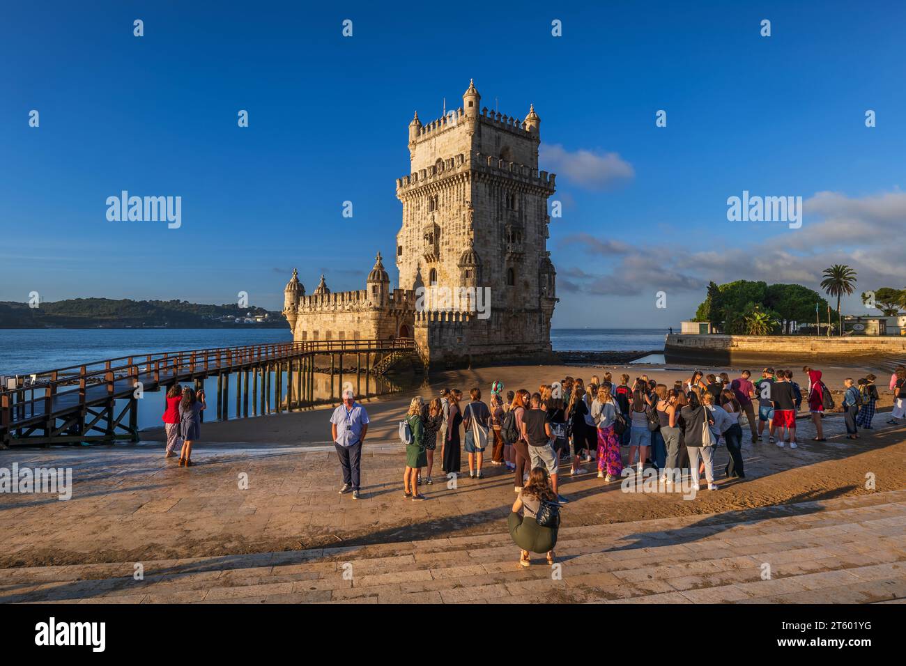Lisbon, Portugal - October 14, 2023 - Belem Tower at sunrise and group ...