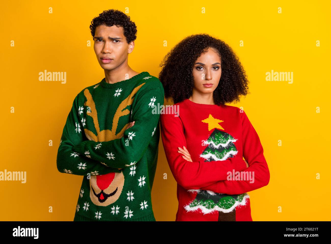 Photo of stressed unhappy guy girl dressed christmas ugly print pullover arms folded dislike ...