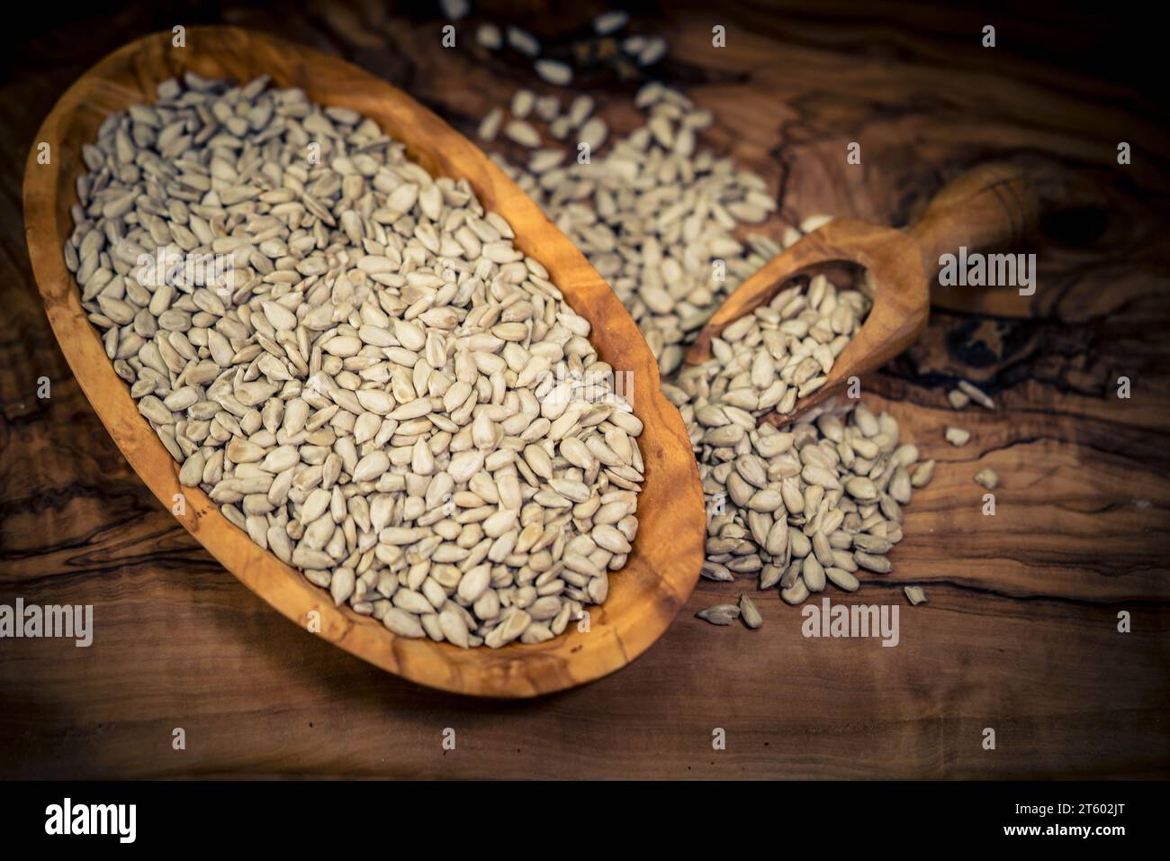 Sunflower Helianthus annuus Seeds on olive wood Stock Photo - Alamy