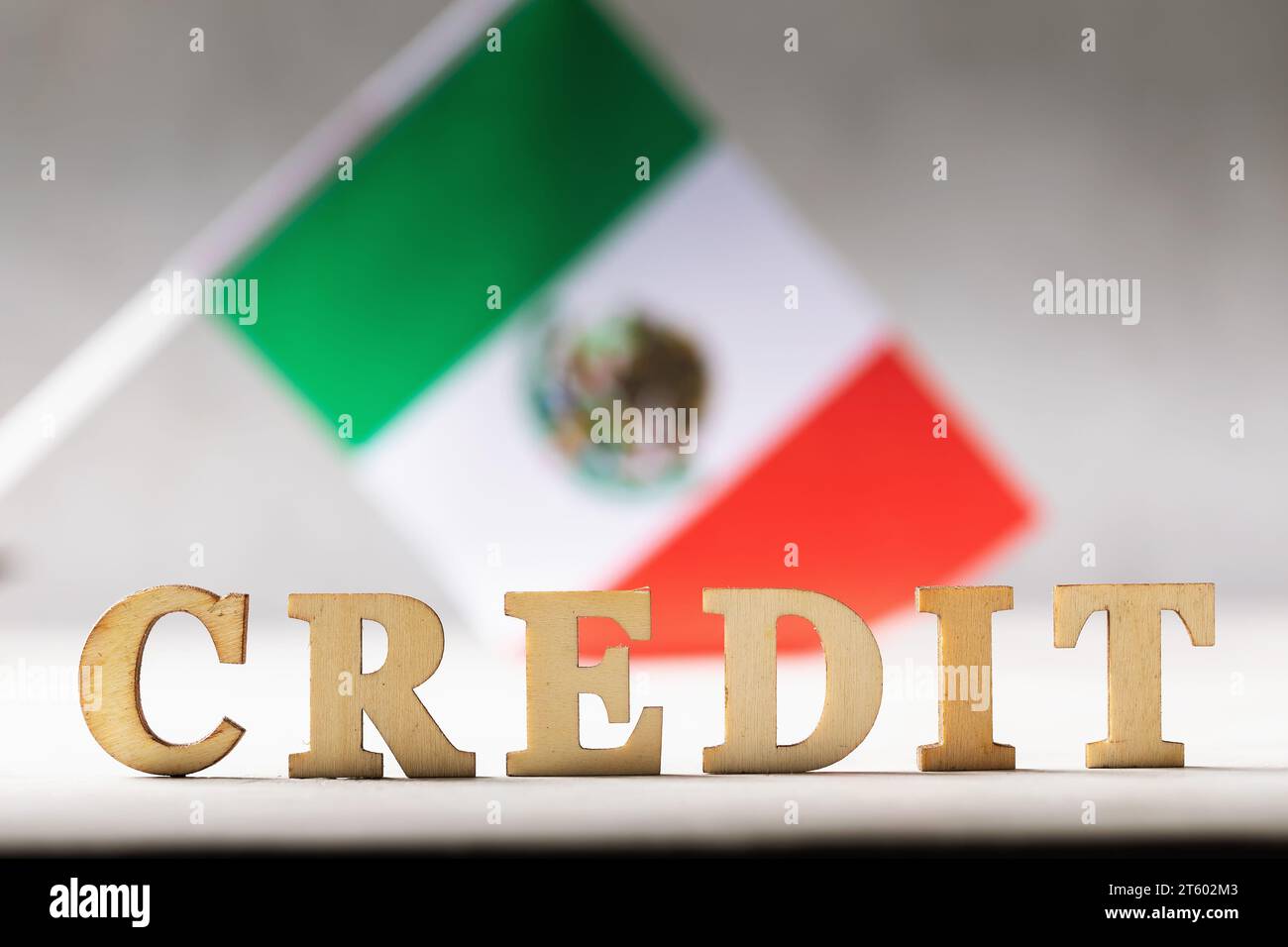 Text made of wooden letters and Mexican flag on an abstract background ...