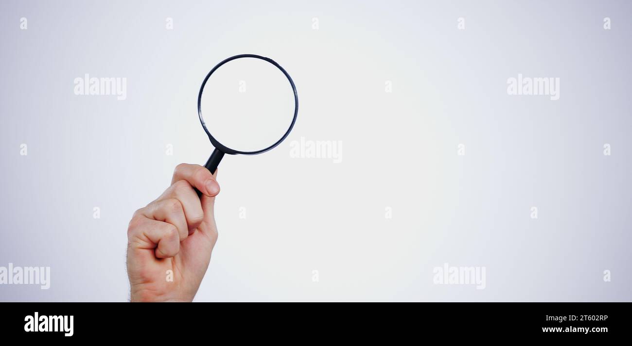 Magnifying glass searching for deals, hand and investigation, search or ...