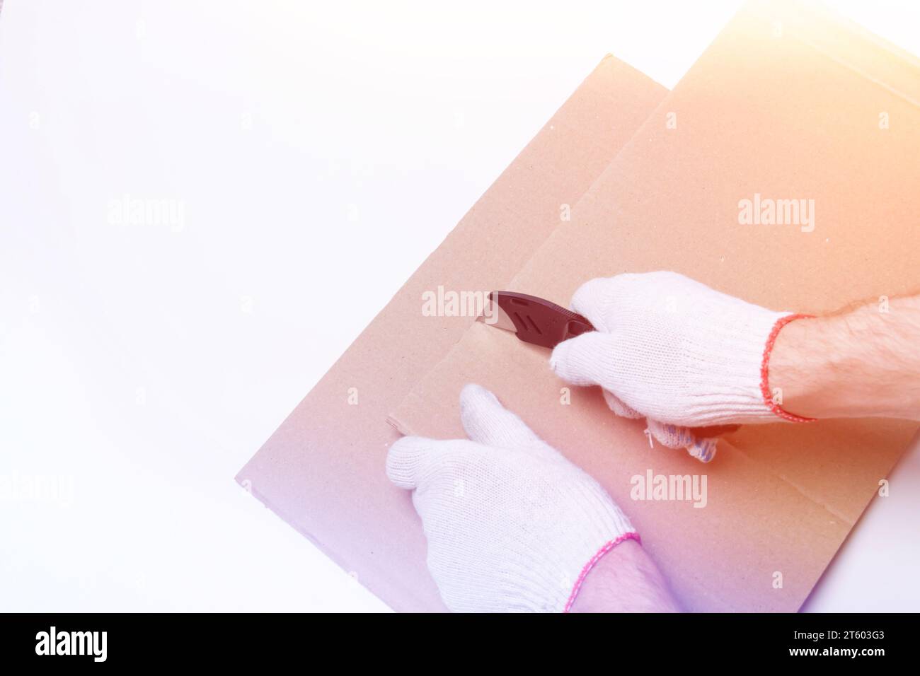 Stretch film and cardboard packaging on a white background top view ...