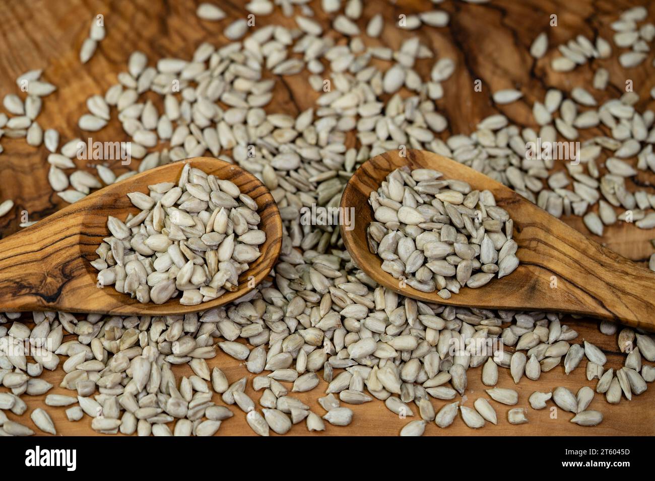Sunflower Helianthus annuus Seeds on olive wood Stock Photo - Alamy
