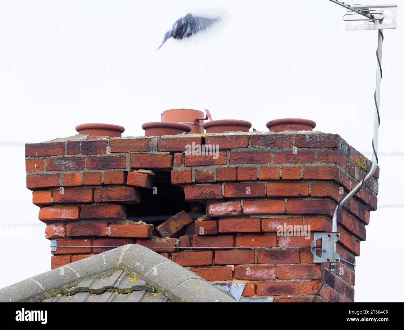 chimney stack damage. Hole in side Stock Photo - Alamy