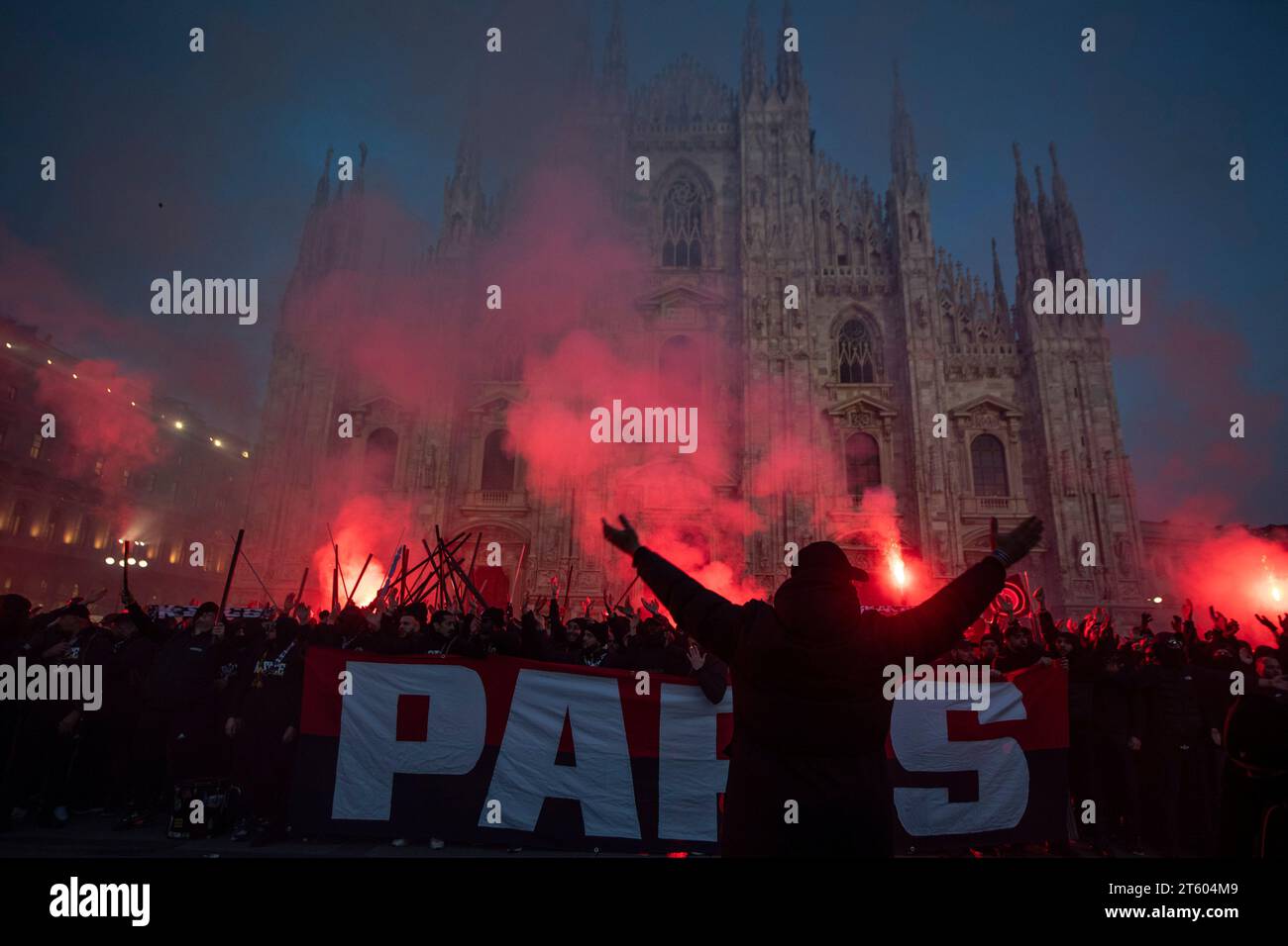 PSG fans light flares in front of Milan's gothic cathedral, Italy ...