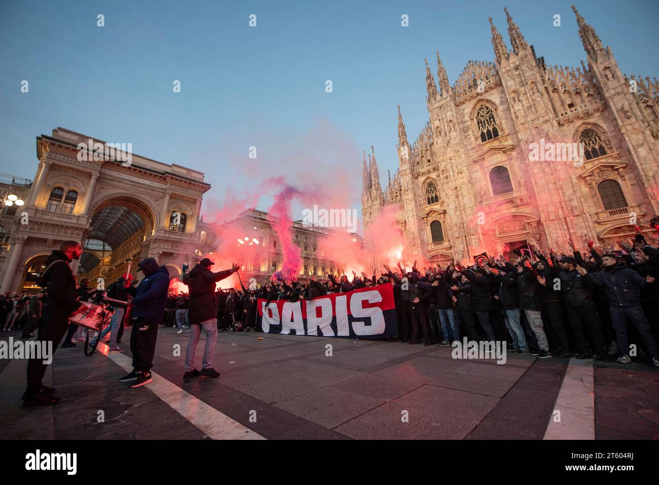 PSG fans light flares in front of Milan's gothic cathedral, Italy ...