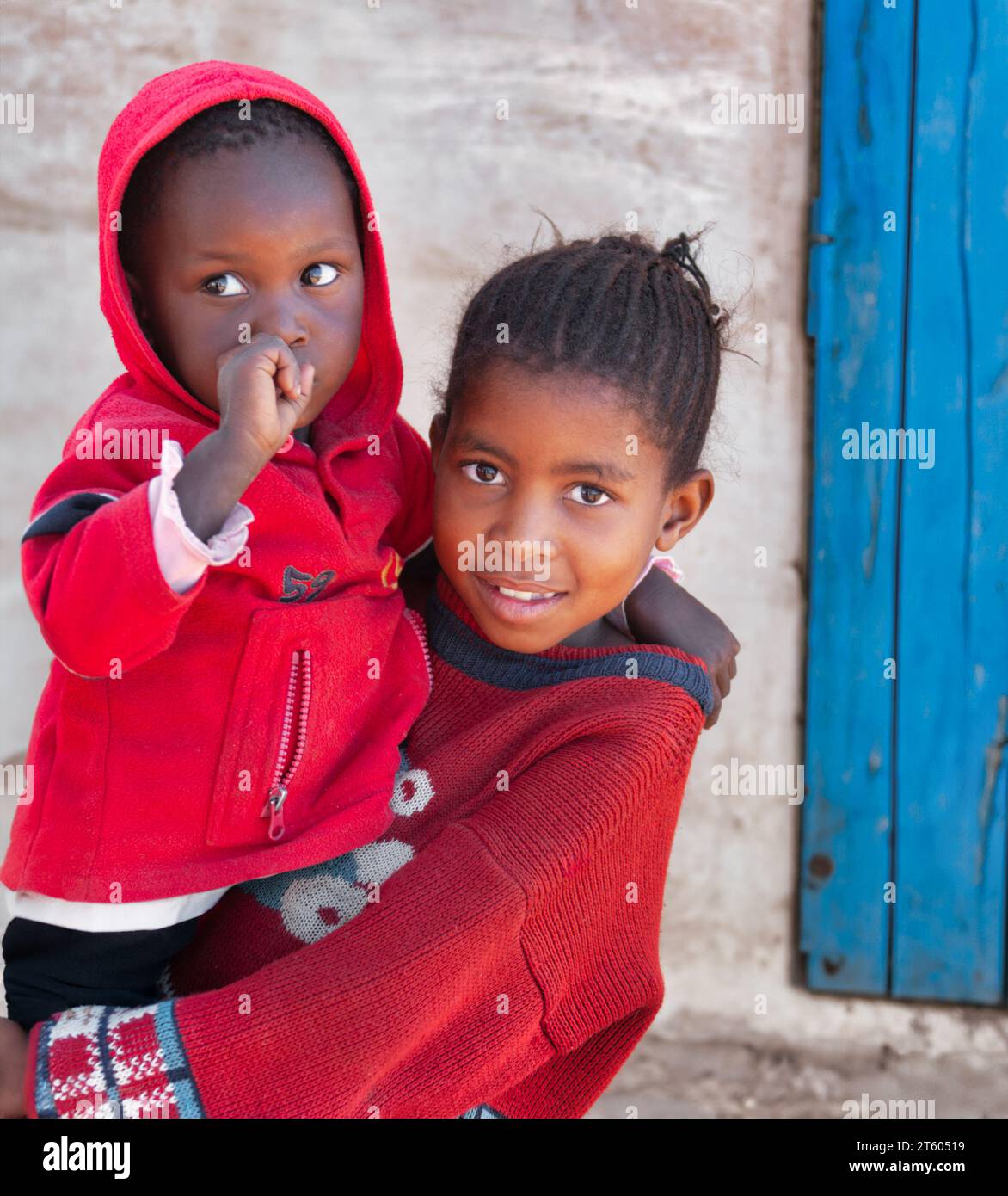 Family African children, sister holding in her arms the little brother ...