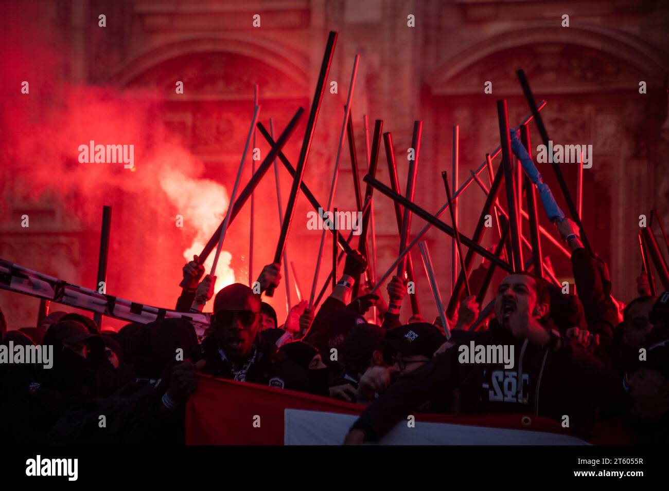 PSG fans light flares and raise sticks ahead of the Champions League ...