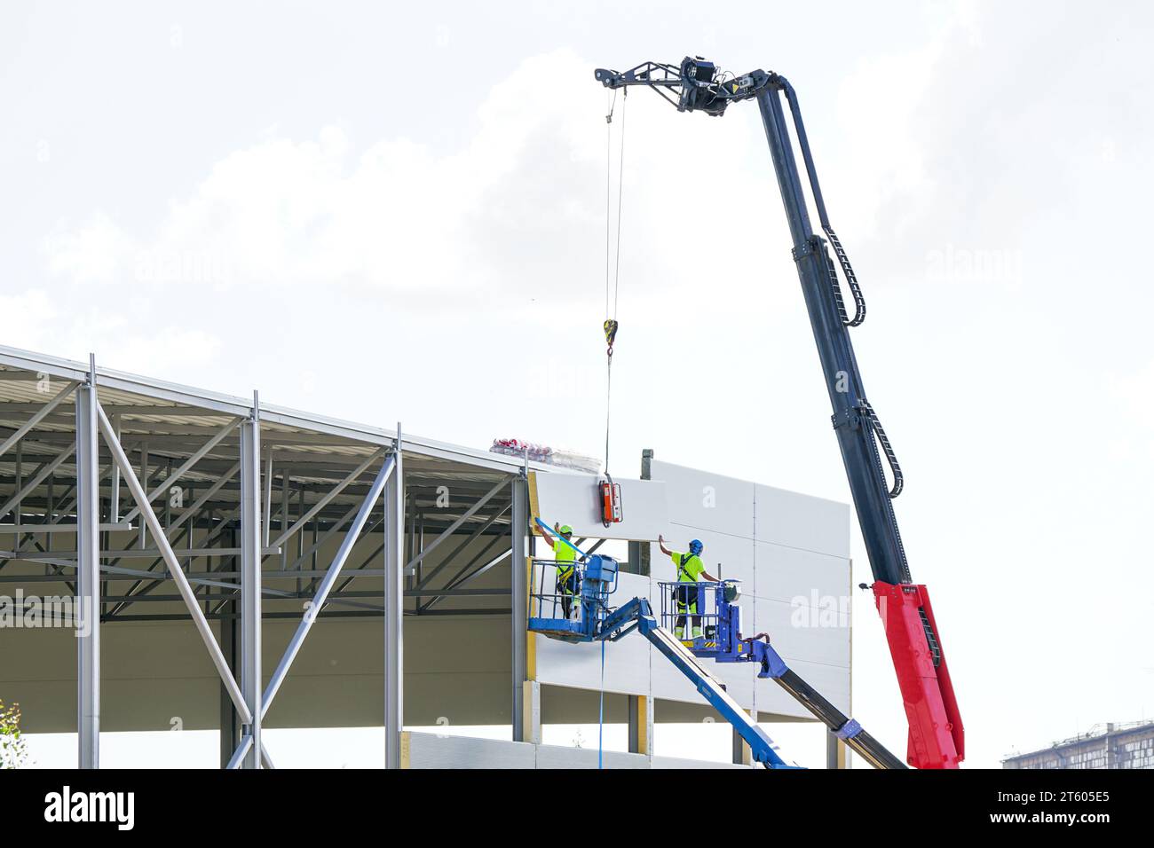 Sandwich panels wall assembly using telescopic boom crane and two self ...